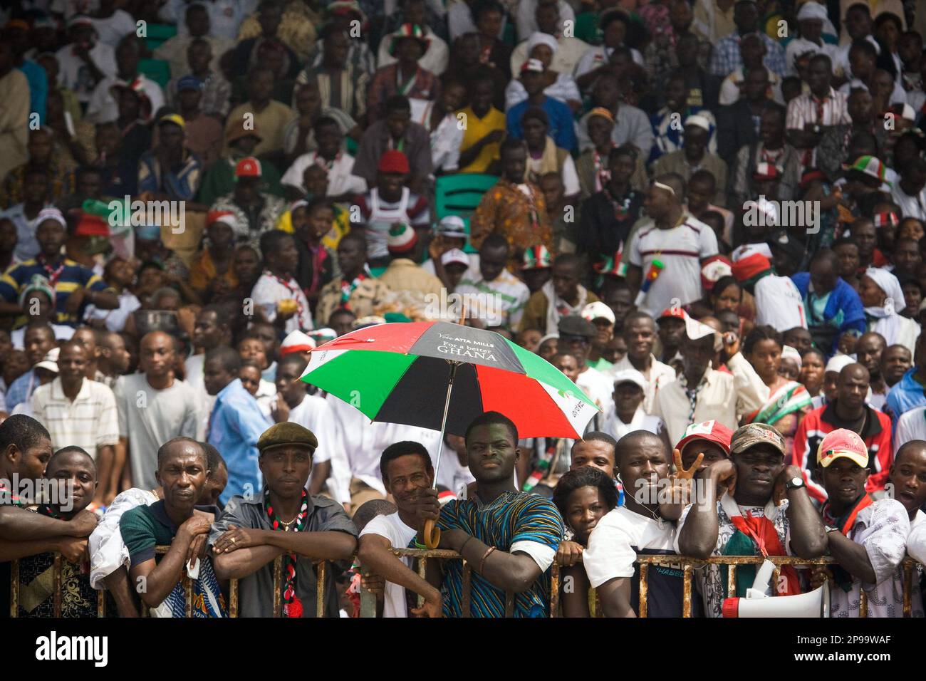People wait for the start of a ceremony held for the inauguration of ...
