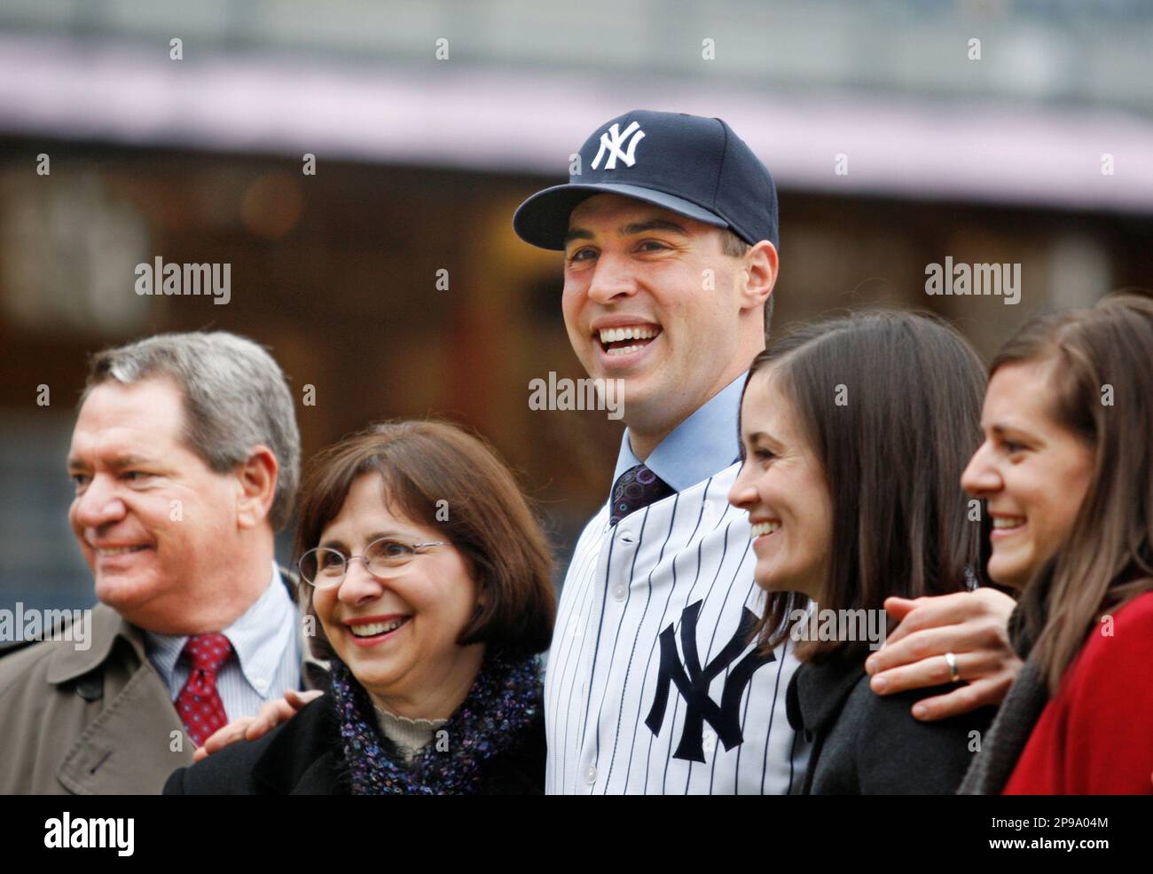 New York Yankees new first baseman Mark Teixeira, center, poses for ...