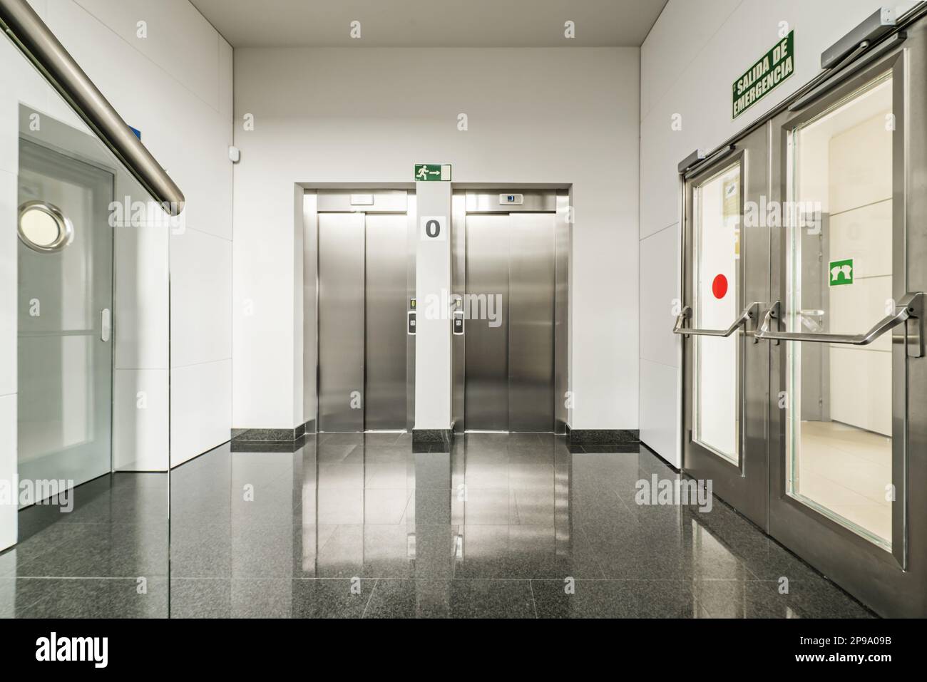 Interior corridor of an office building polished black granite floors ...