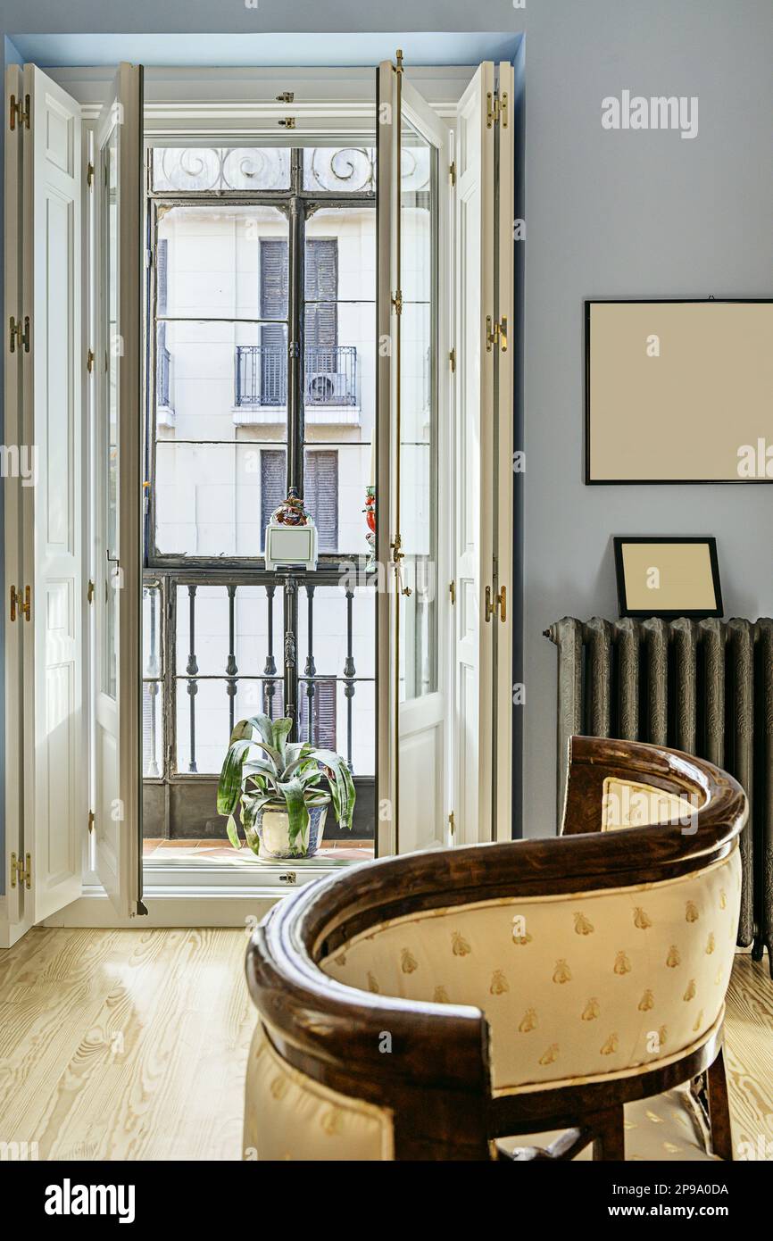 Living room of a house decorated in vintage style with an armchair with ...