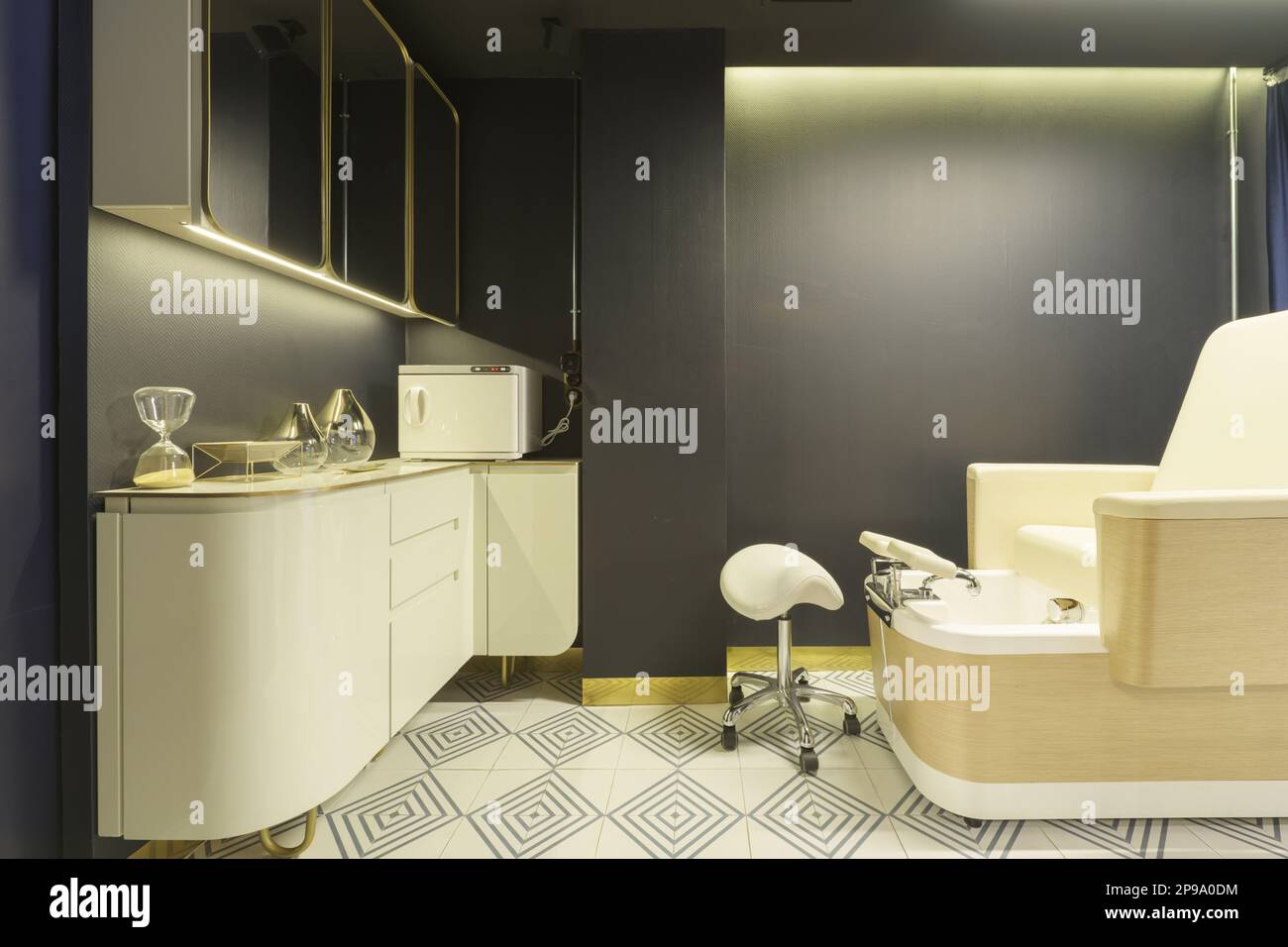 Booth with pedicure chair in the male beauty treatment area of a barber ...