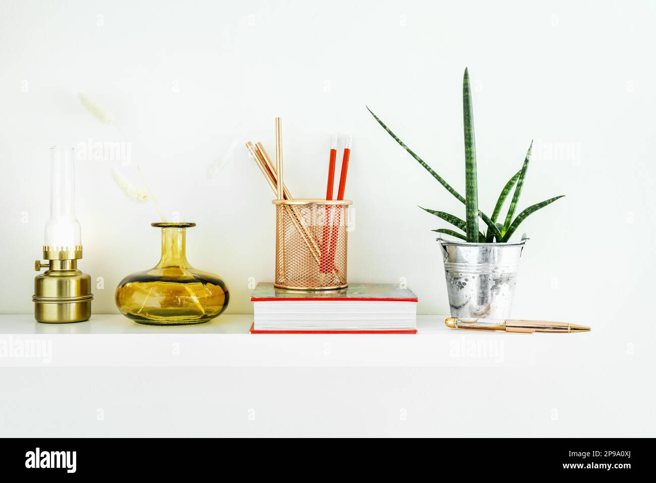 white shelf with decorative objects and indoor plants Stock Photo - Alamy