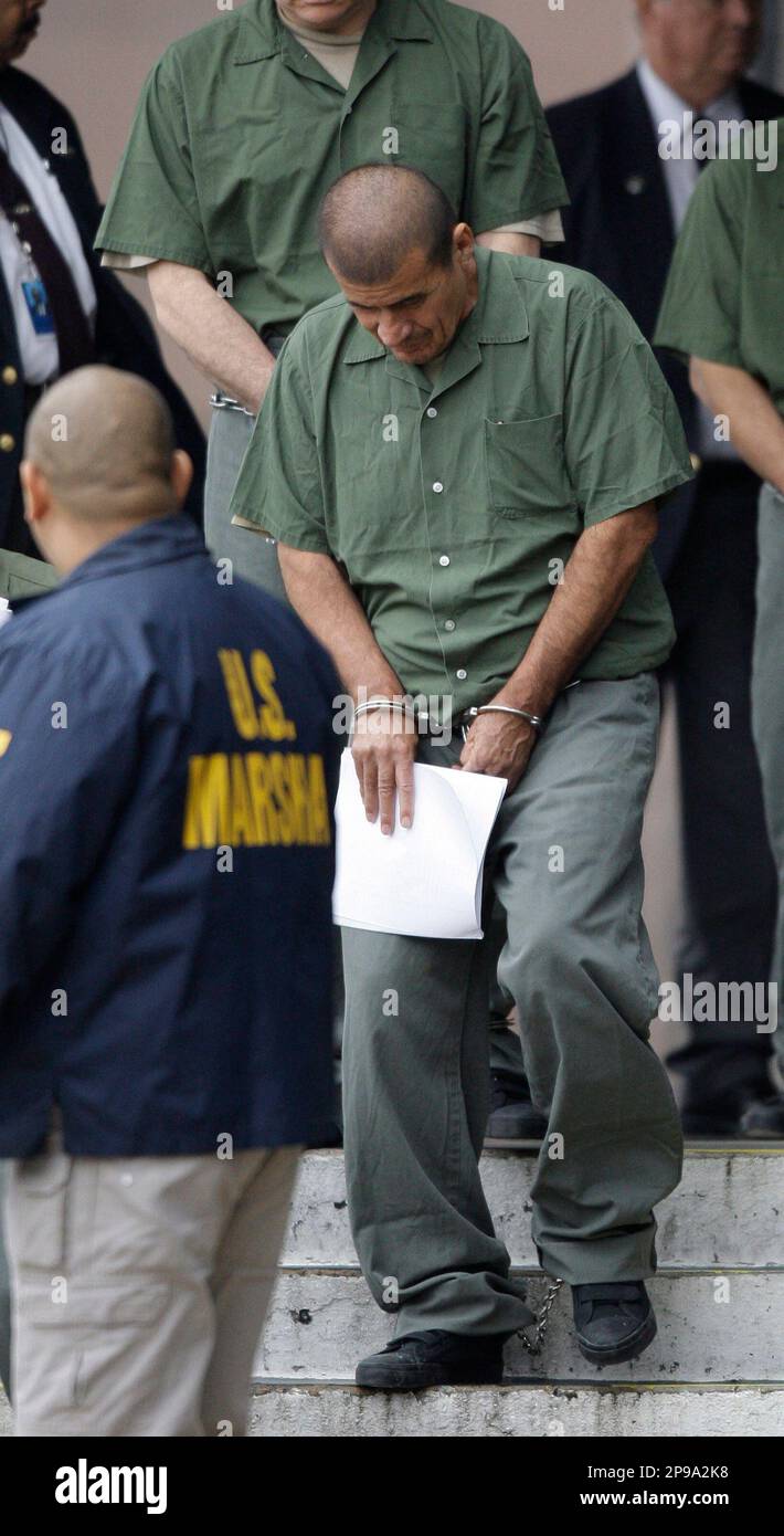 Armando Martinez Duarte, center, leads a group of men alleged to be ...