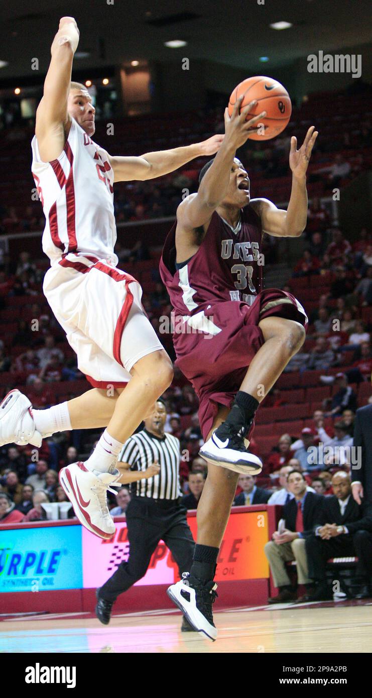 Maryland-Eastern Shore guard Chris Conner, right, goes up for a shot in ...