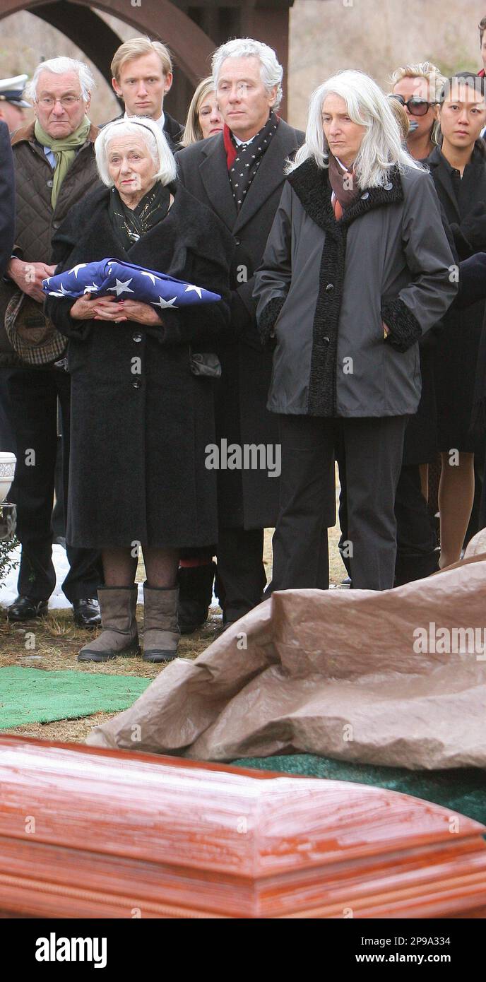 Nuala Pell holds a folded American flag that draped the casket of her ...