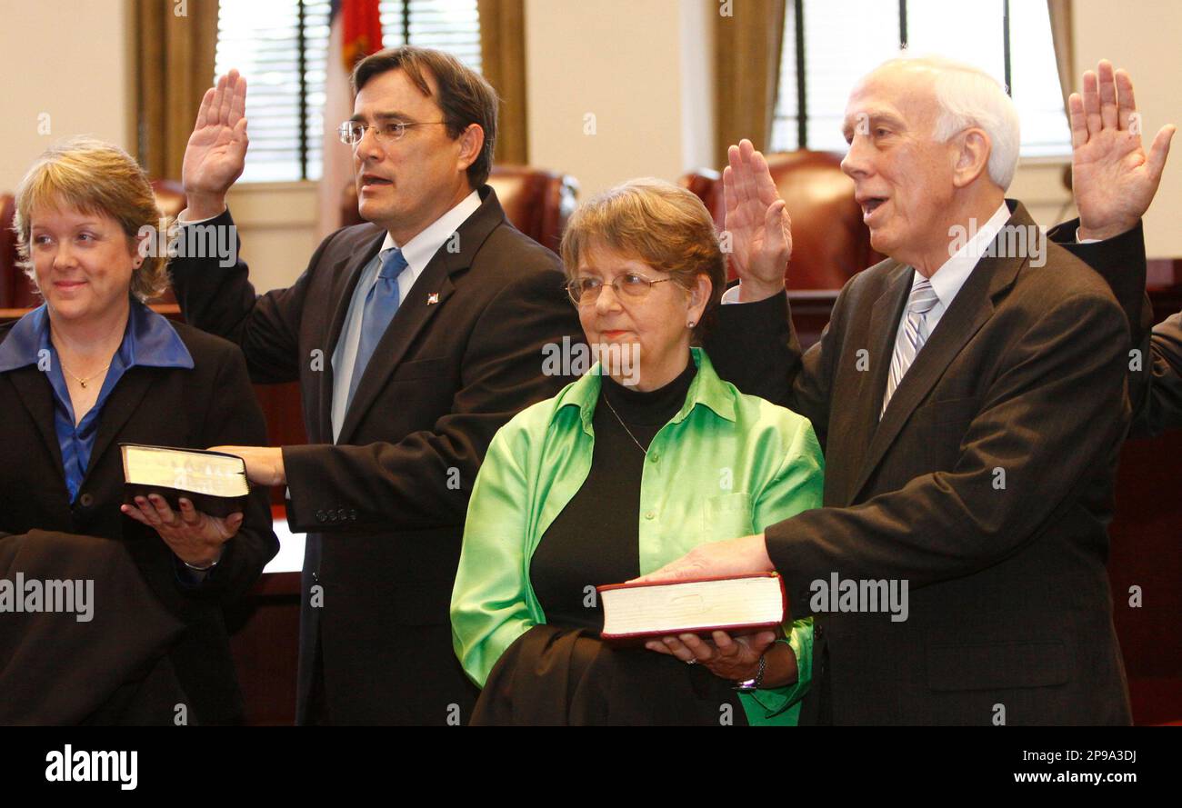 Gayla Pierce, left, and Mary Kitchens, second from right, hold their ...