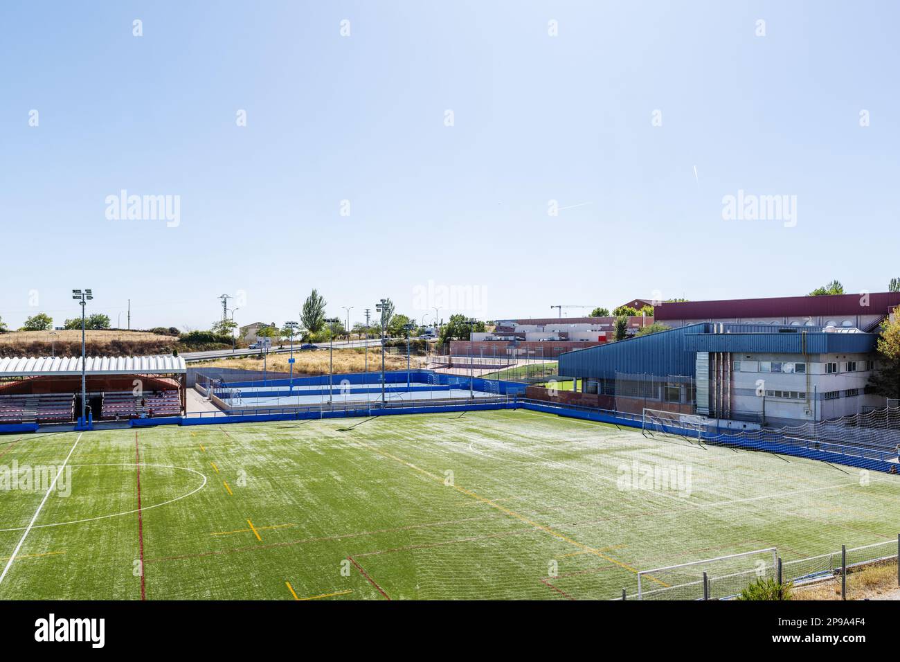 Grass and blue cement soccer fields for training and matches of ...
