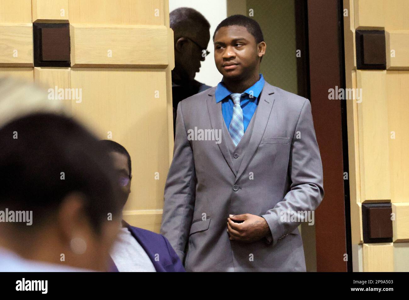 Suspected shooting accomplice Trayvon Newsome enters the courtroom ...