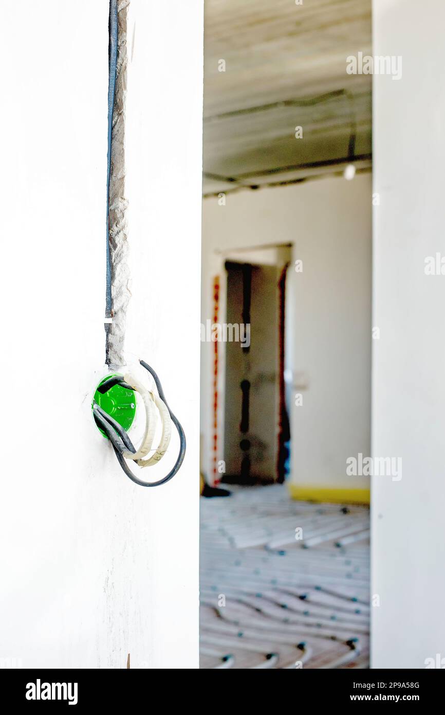 New wiring in plastic box and electrical cables for future wall sockets ...
