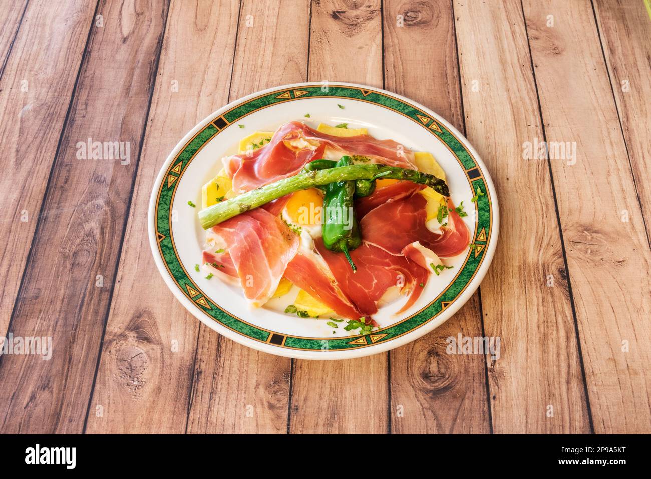A wonderful and typical Spanish restaurant tapa with scrambled eggs ...