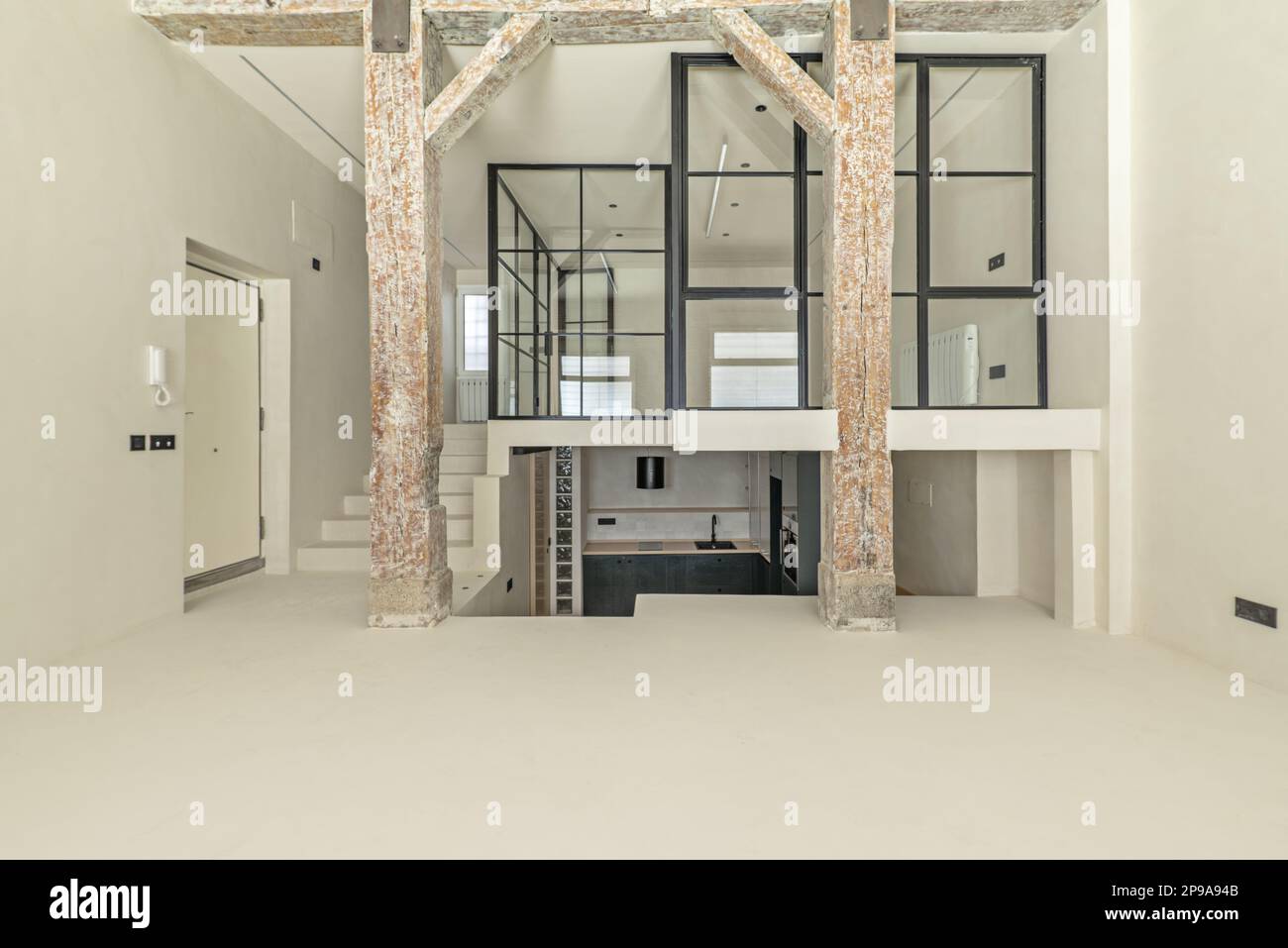 A beautiful empty loft with an old structure of wooden beams and ...