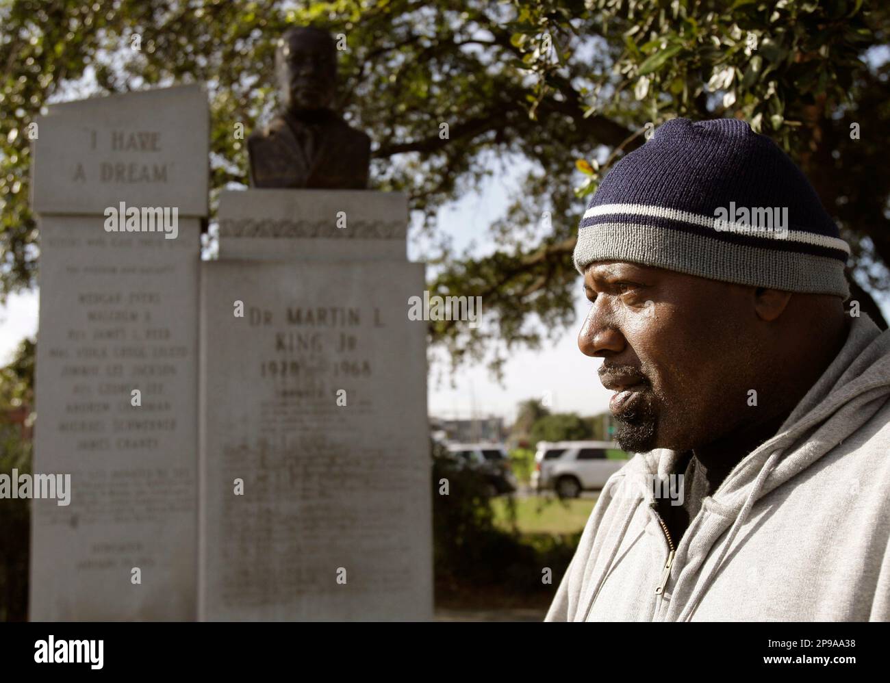 Rev. John Raphael Jr. talks with friends in the median of Claiborne ...