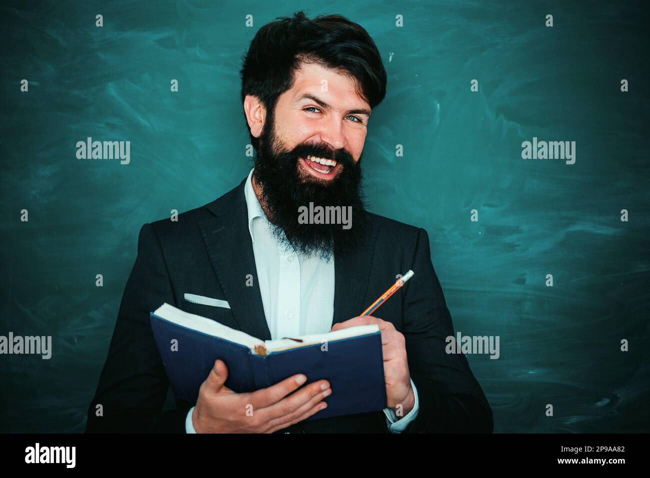 Bearded professor at school lesson at desks in classroom. Education ...