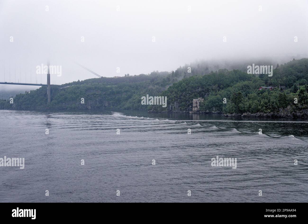 Suspension bridge between Askoy and Bergen, Norway in a cloudy day ...
