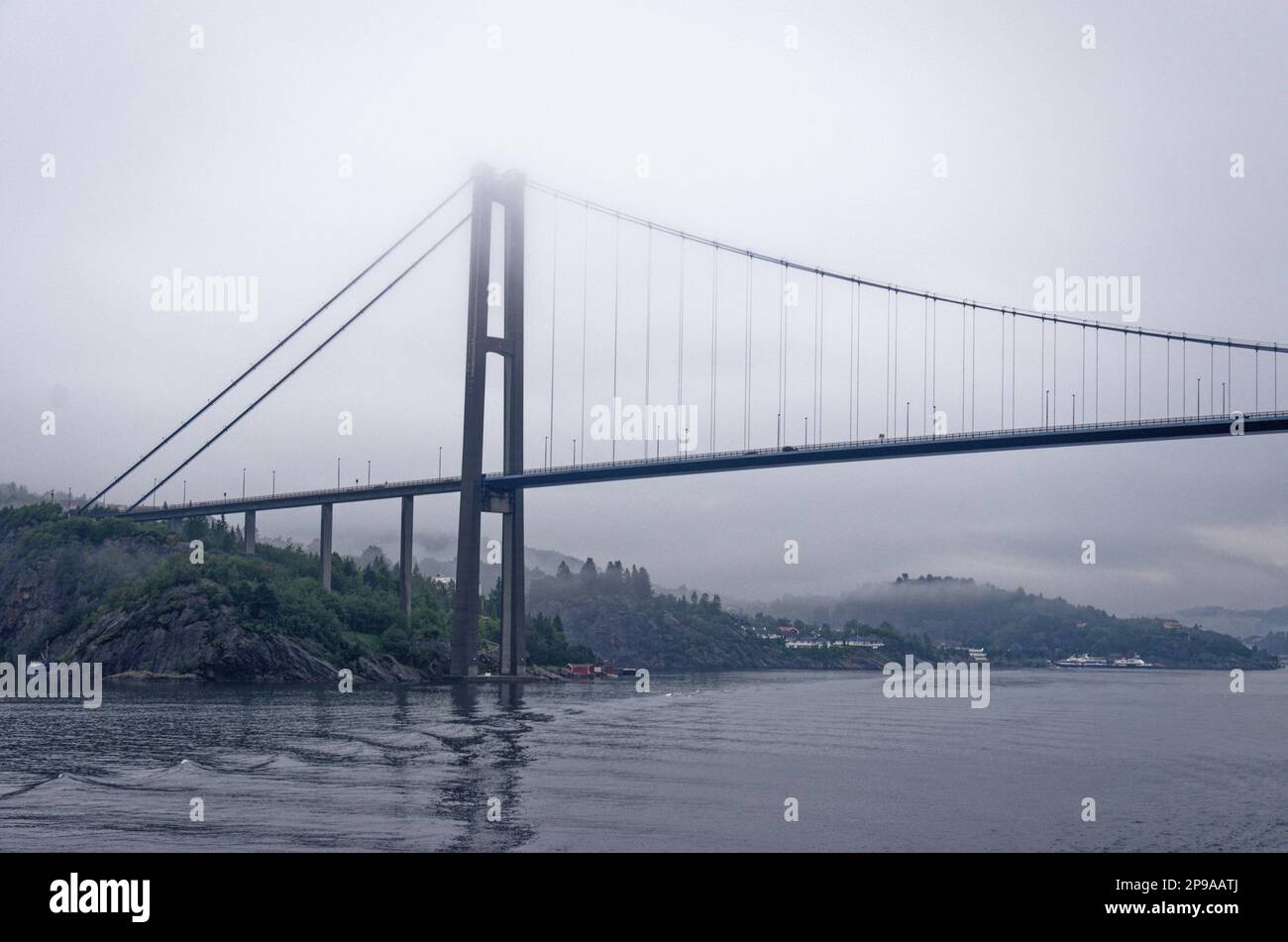Suspension bridge between Askoy and Bergen, Norway in a cloudy day ...