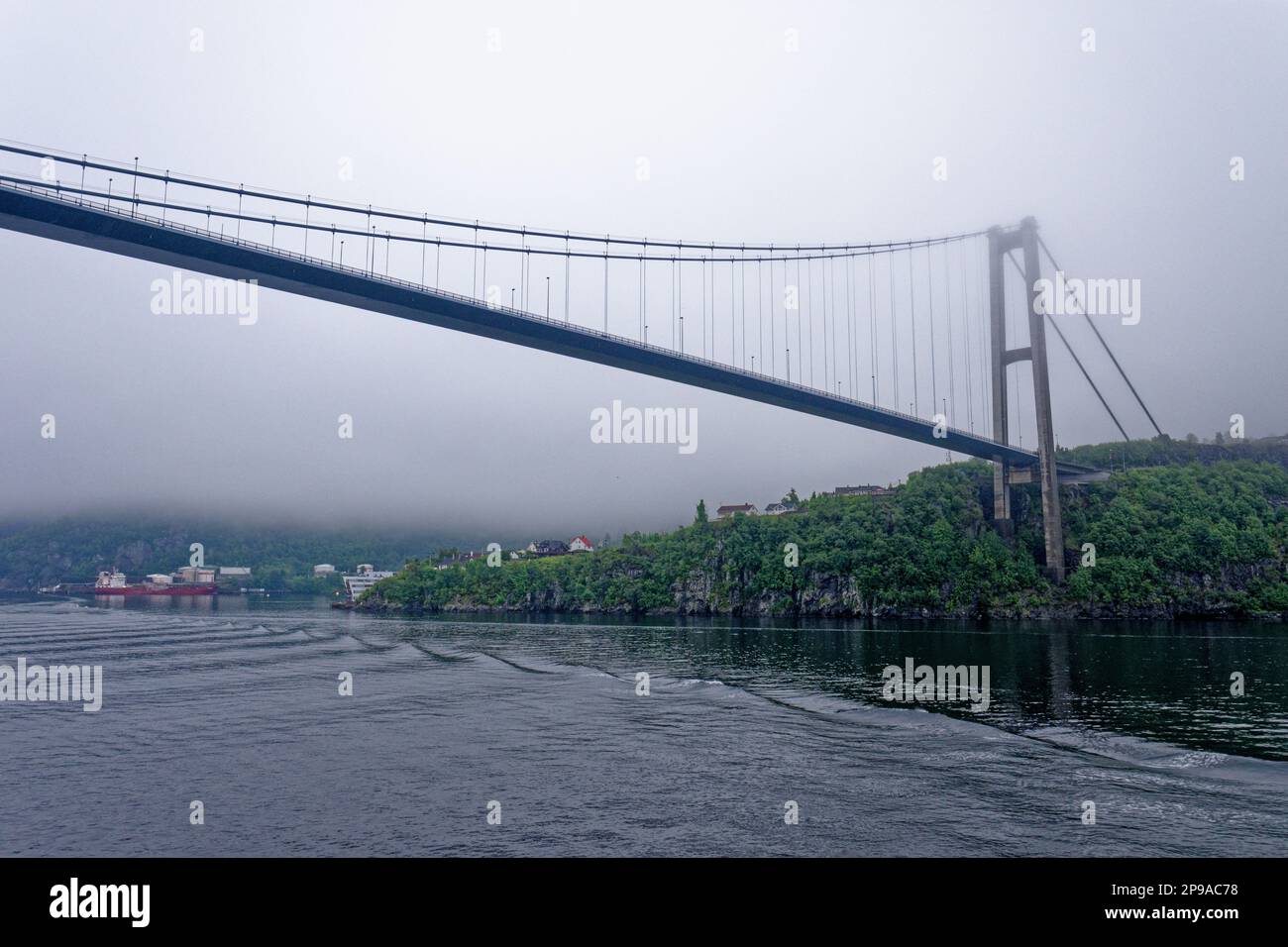 Suspension bridge between Askoy and Bergen, Norway in a cloudy day ...
