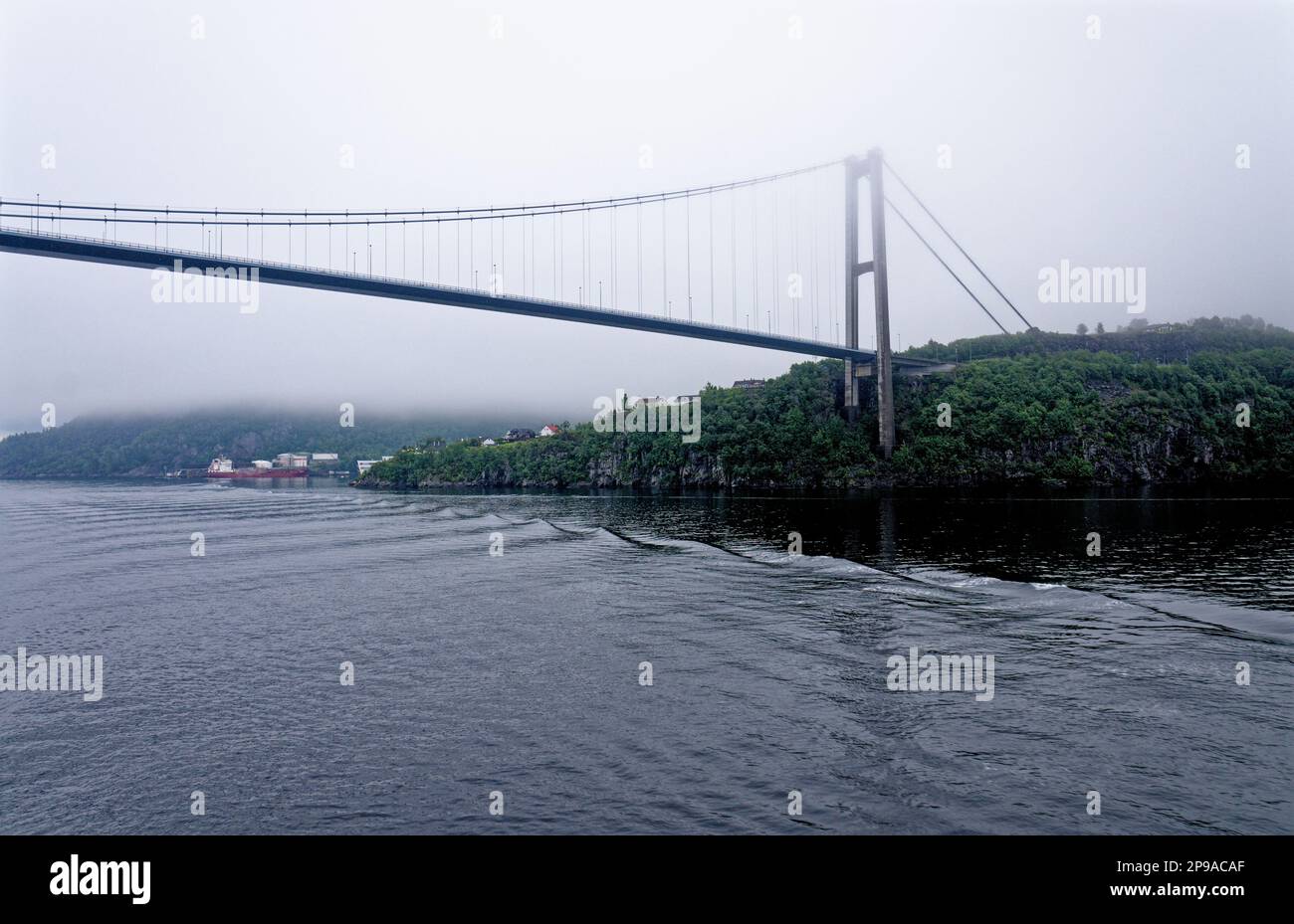 Suspension bridge between Askoy and Bergen, Norway in a cloudy day ...