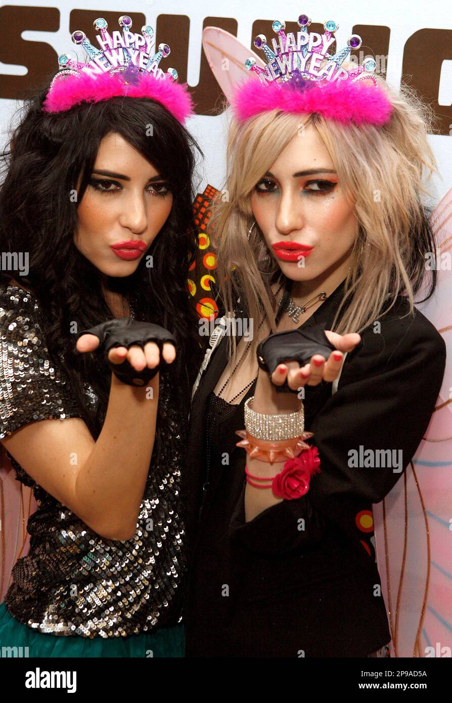 Members of The Veronicas Lisa, left, and Jess Origliasso pose backstage ...