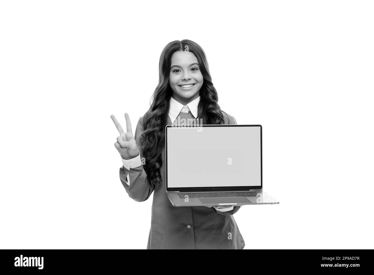 happy face of teen girl with long curly hair show computer isolated on ...