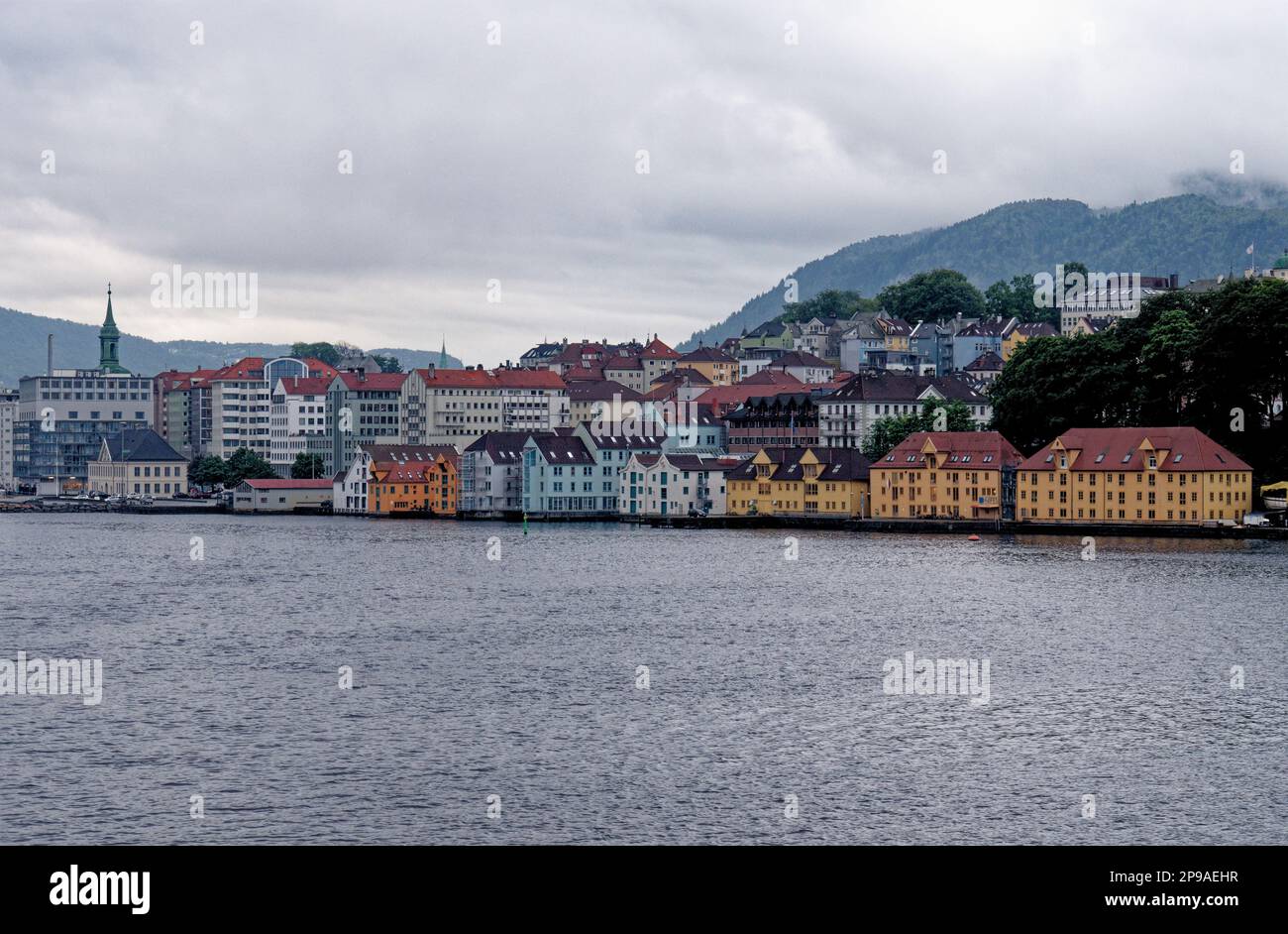 Offshore view across Vagen harbour to Torget waterfront and Mount ...