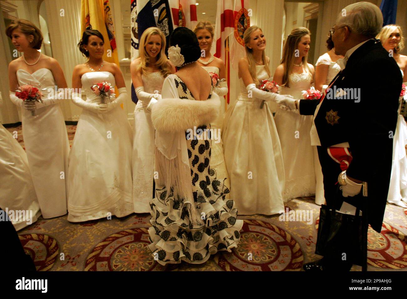 Ann-Hunter Van Kirk, third from left, of New Orleans greets guests at ...