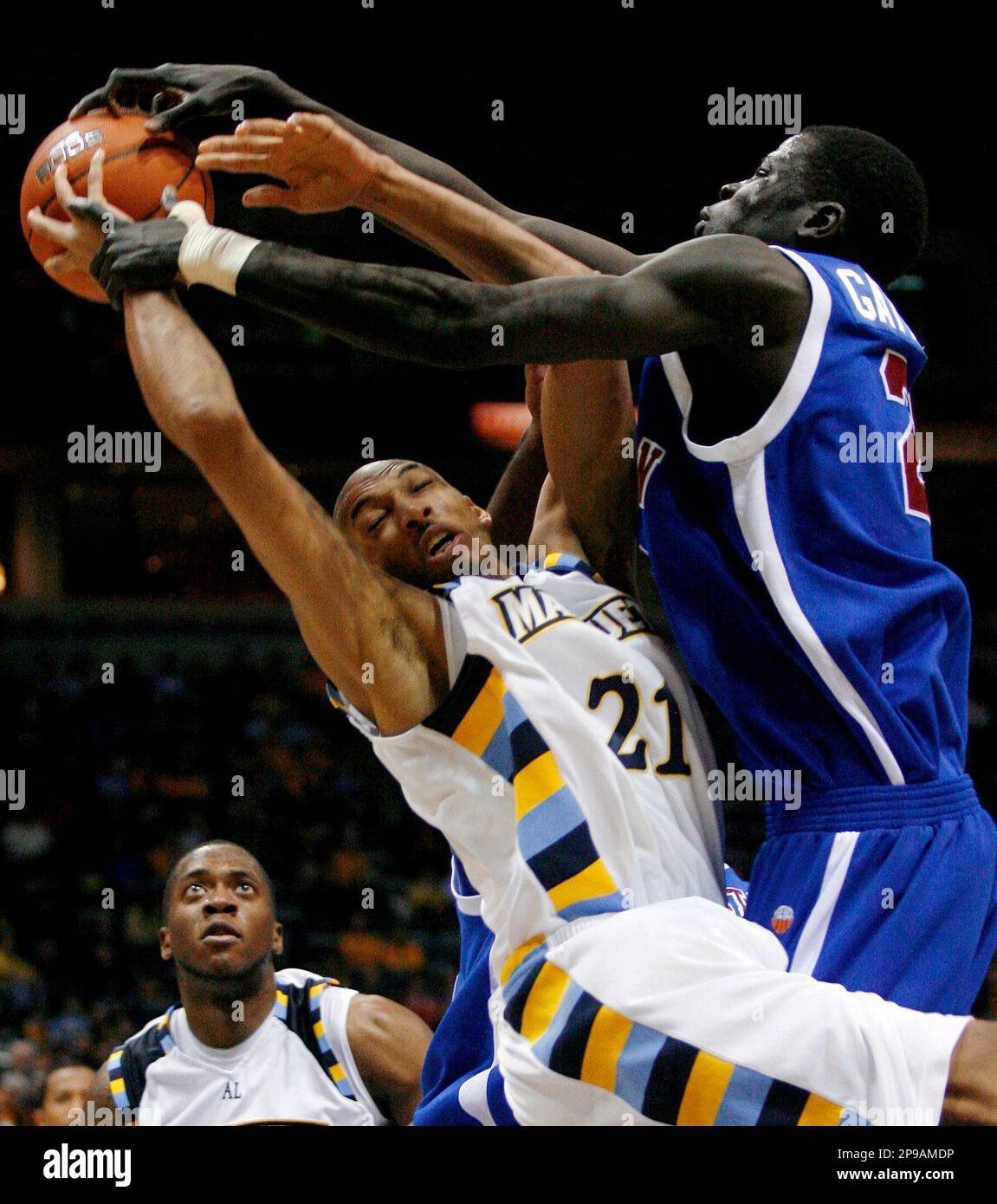 Marquette's Joseph Fulce, left, fights for the rebound against ...