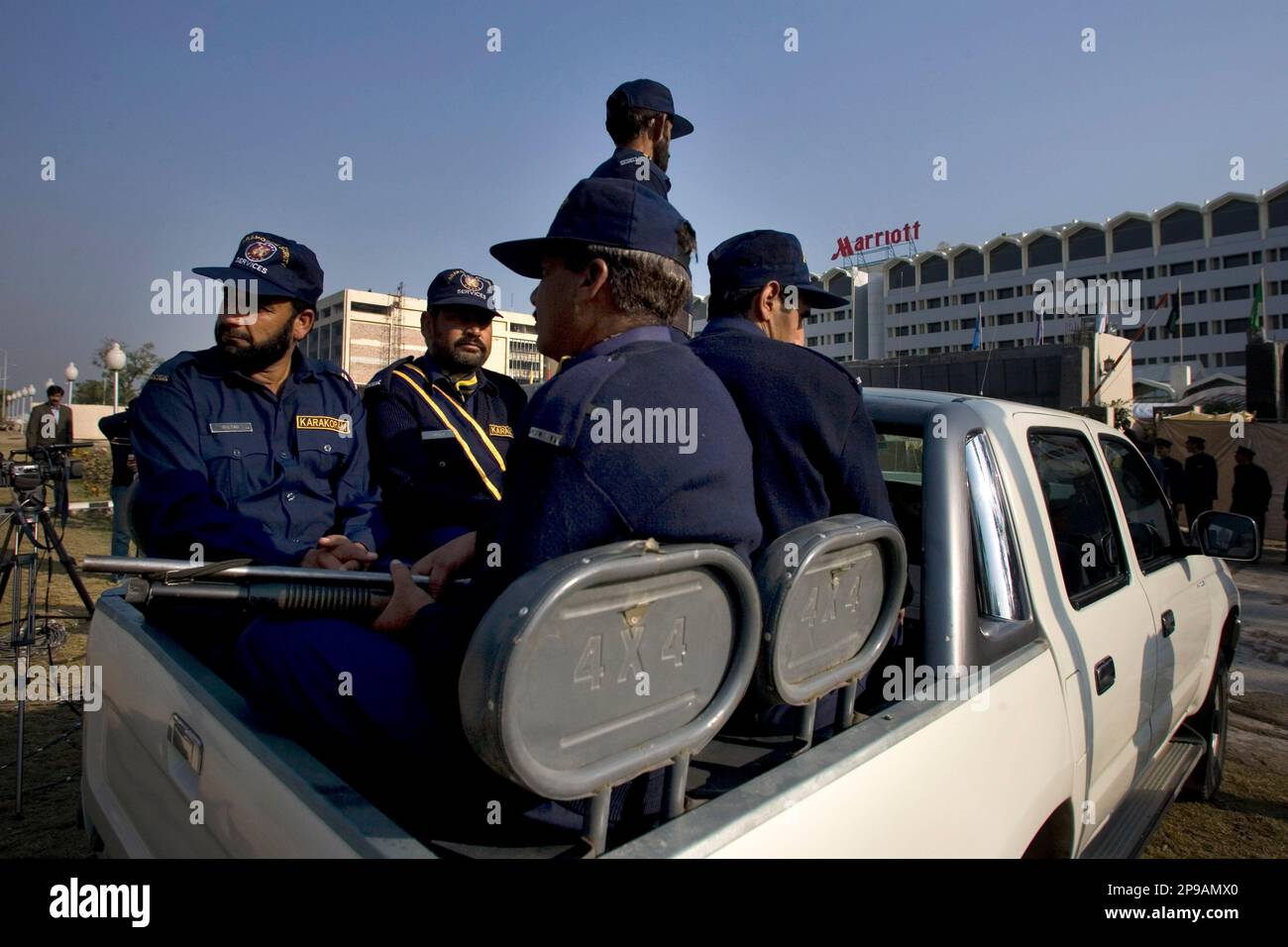 Pakistani private security personnel guard the main entrance of the ...