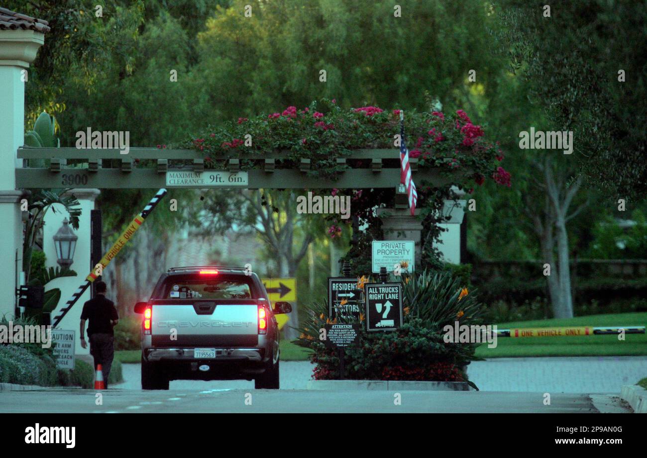 A vehicle enters the gated community Friday, Sept. 19, 2008, in Irvine ...