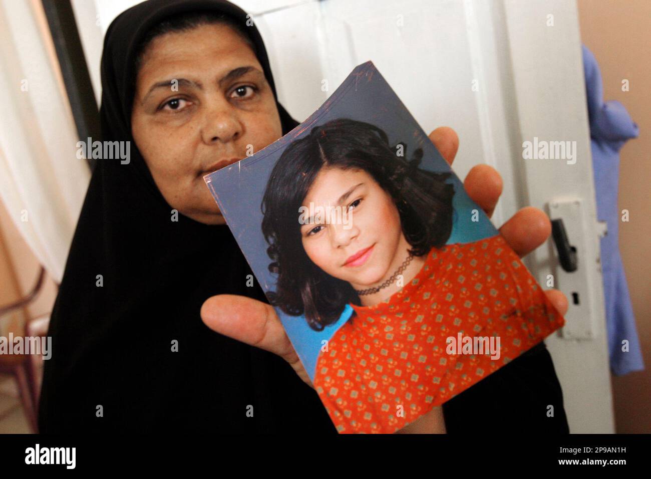 Salwa Mahmoud, 53, holds a photo of her daughter Shyima on Sept. 24 ...