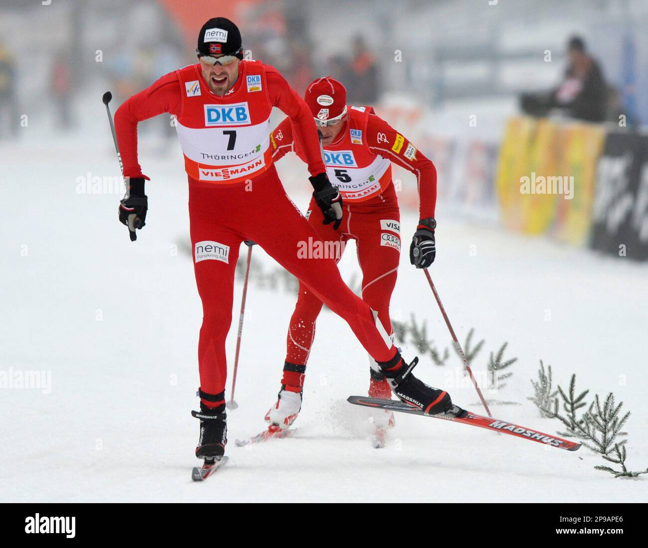 Magnus Moan of Norway, left, winner, crosses the finish line ahead of ...