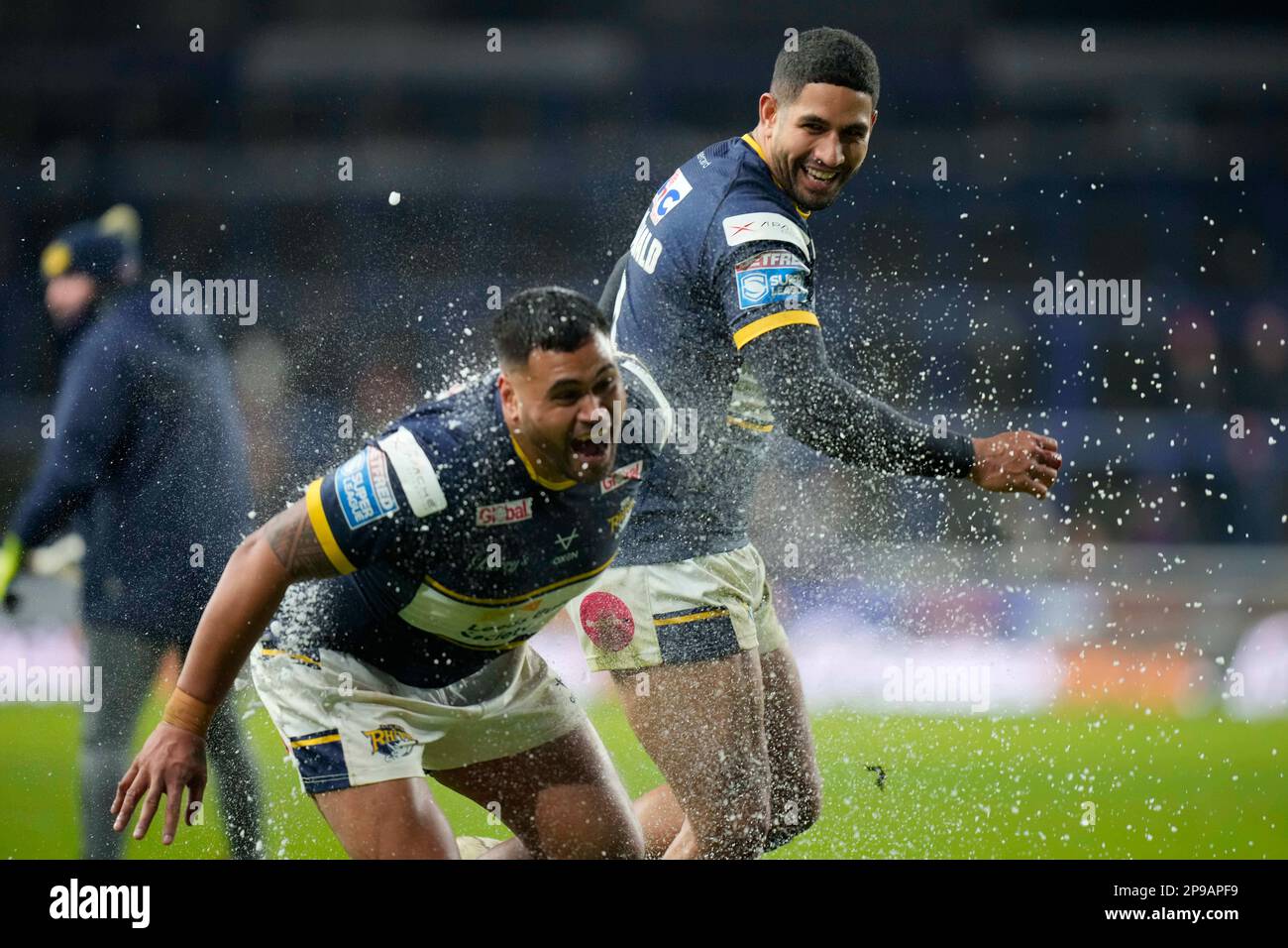 Nene Macdonald #4 of Leeds Rhinos trows a snowball at Sam Lisone #15 of ...