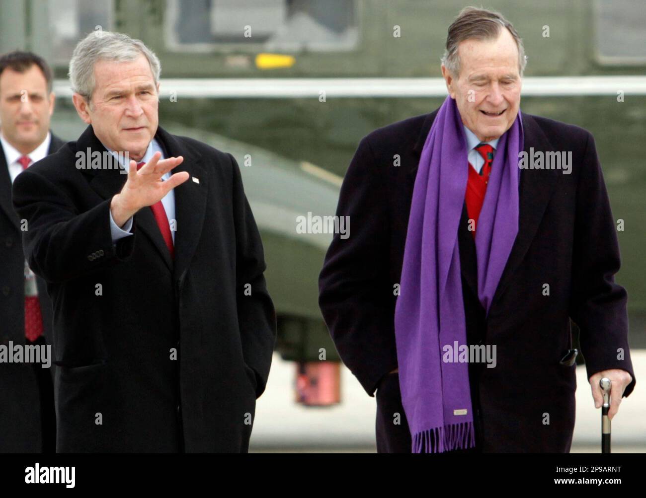 President George W. Bush walks with his father, former President George ...