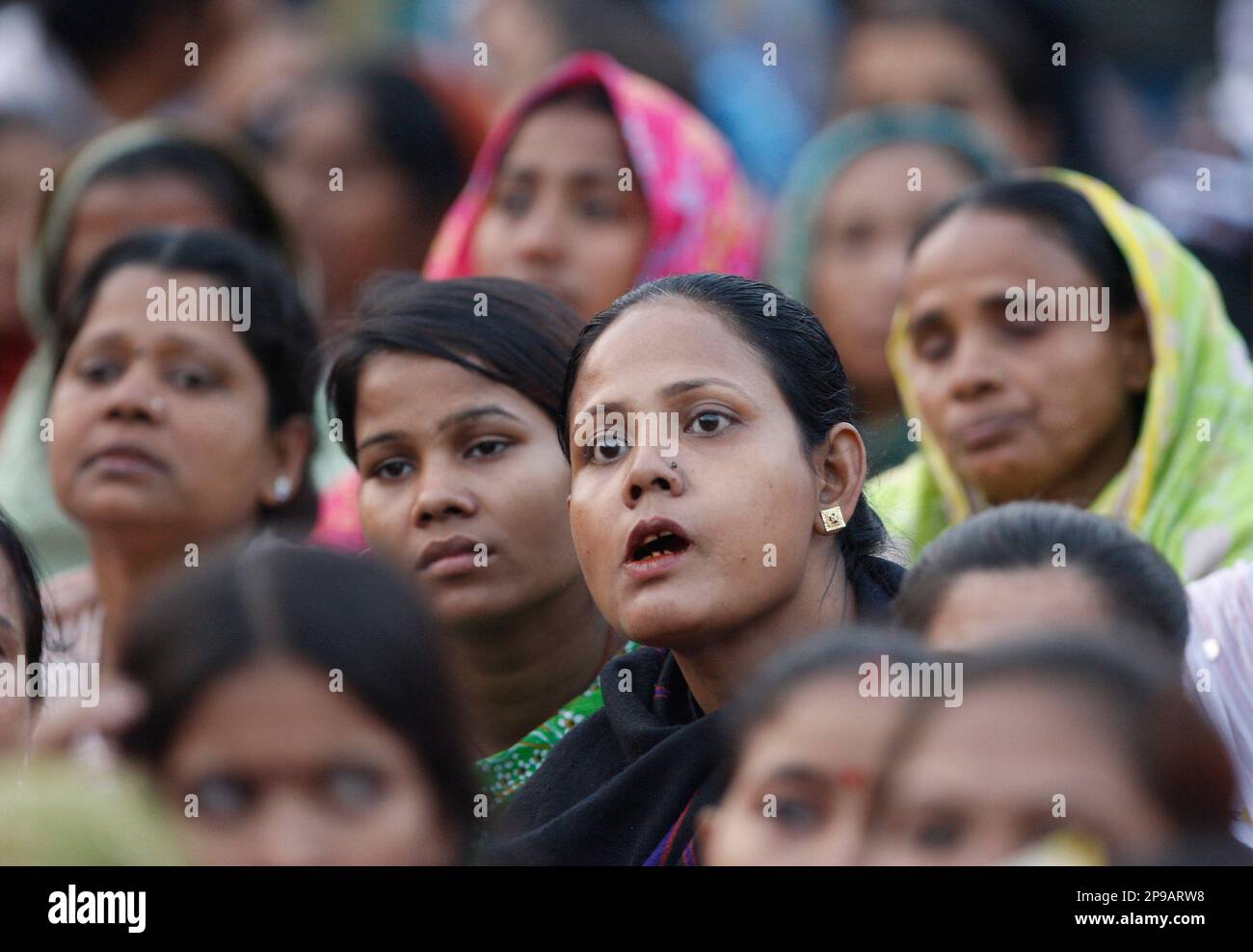Supporters of Awami League party listen to former Prime Minister and ...