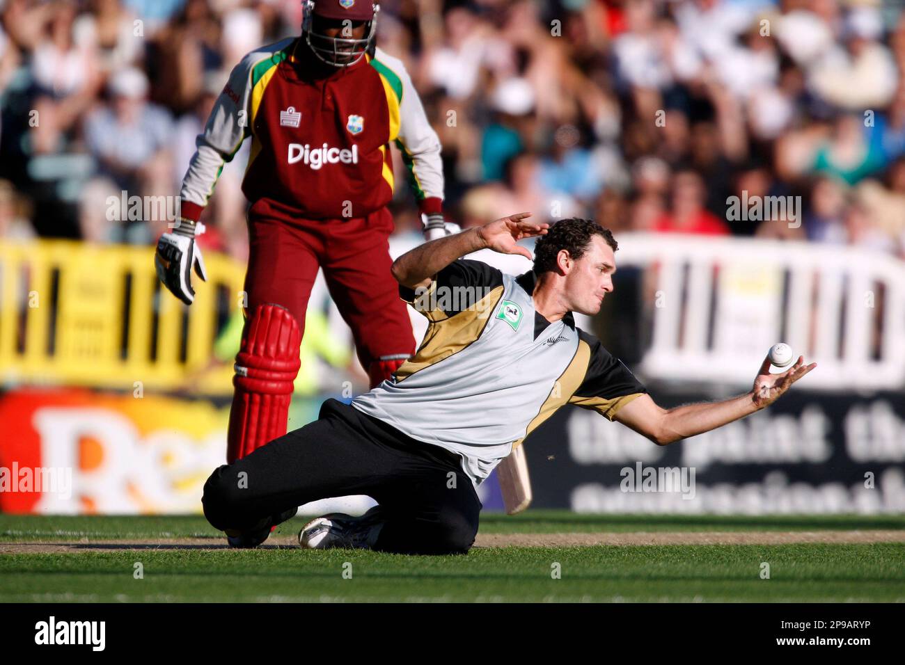 New Zealand's Kyle Mills takes a catch off his own bowling against the ...