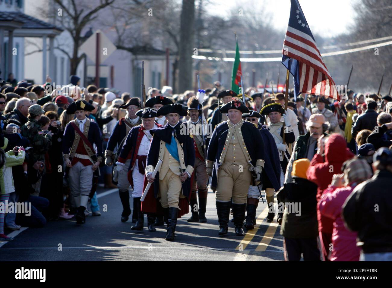 Revolutionary War re-enactor Ronald Rinaldi, center left with blue on ...