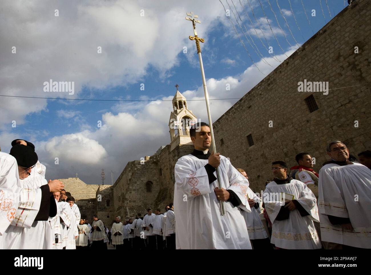 The traditional Christian procession walk past the Church of Nativity ...