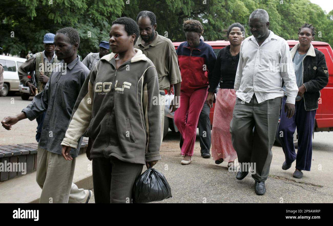 Zimbabwean human rights activist, Jestina Mukoko, back center in red ...
