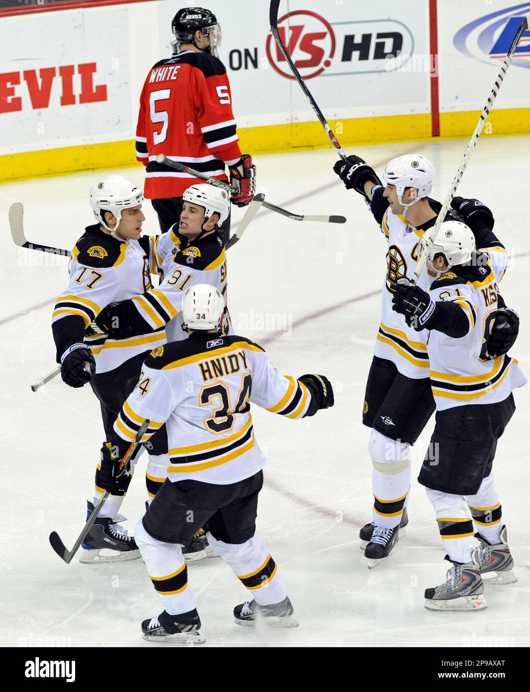 Boston Bruins' Milan Lucic (17) celebrates with Marc Savard (91), Shane ...