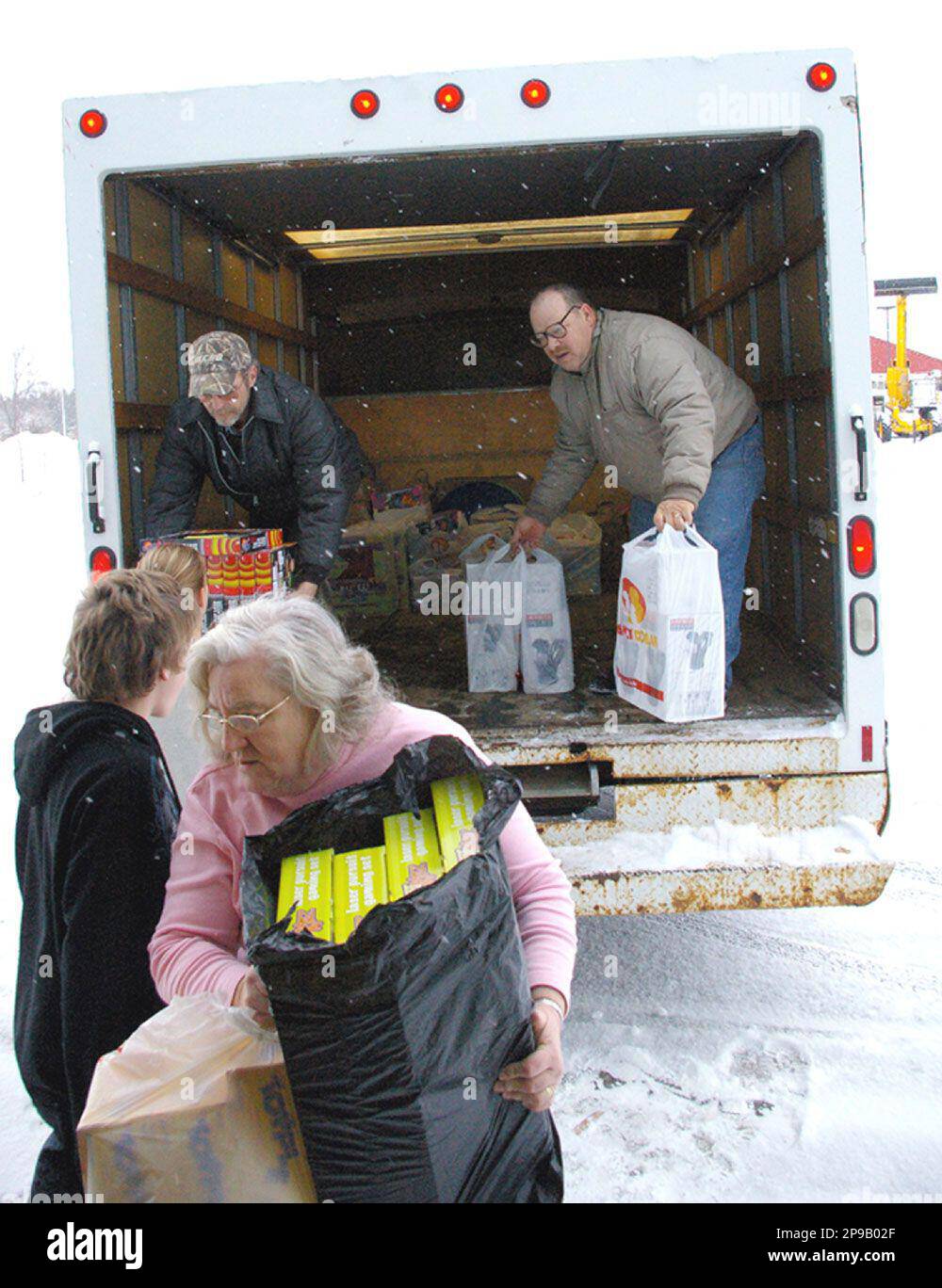 Tim Dean, right, and Grand Rental Station employee Doug Bidwell unload ...