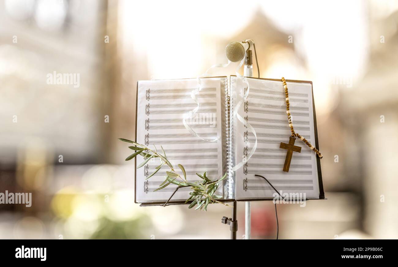 Concept of choral songs for Palm Sunday celebration with music stand ...