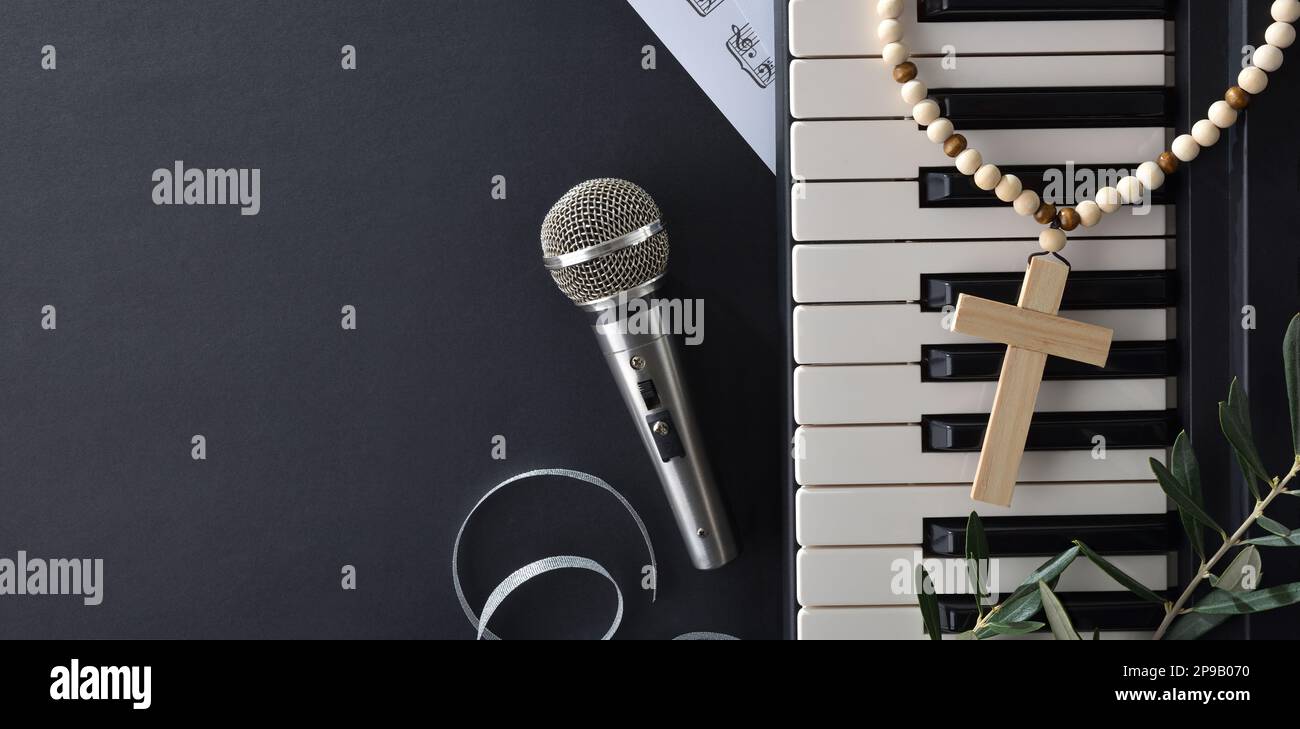 Religious music with piano and choirs on a black table decorated with ...