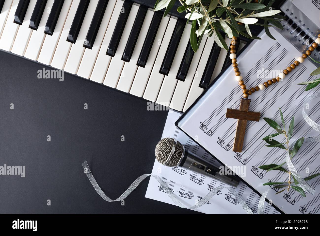 Religious music with piano and choirs on a black table decorated with ...
