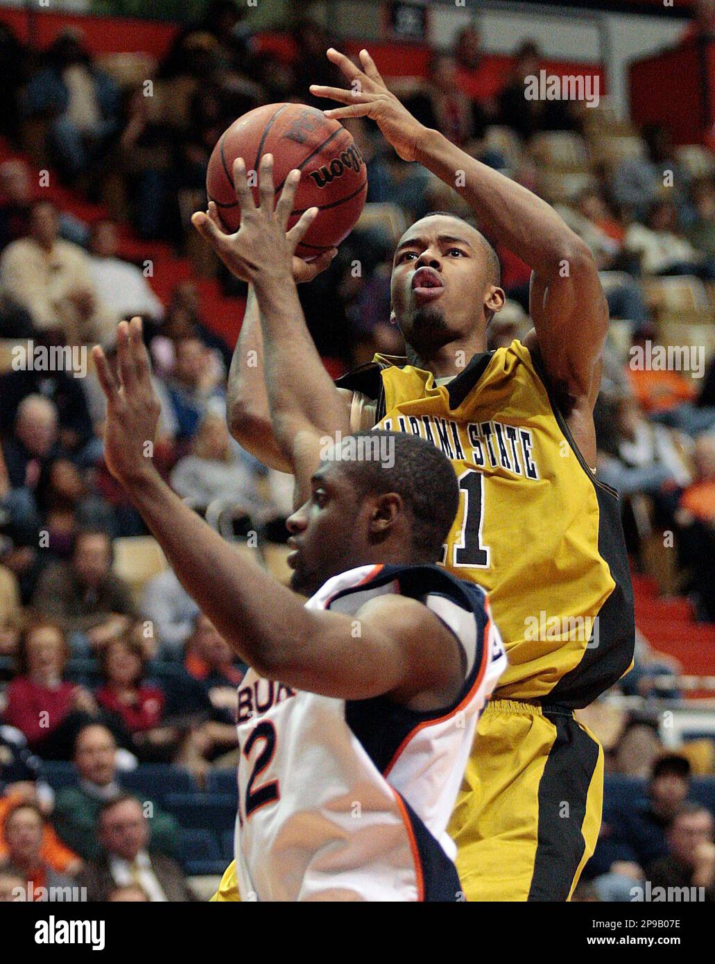 Alabama State's Brandon Brooks (11) shoots over the defense of Auburn's ...