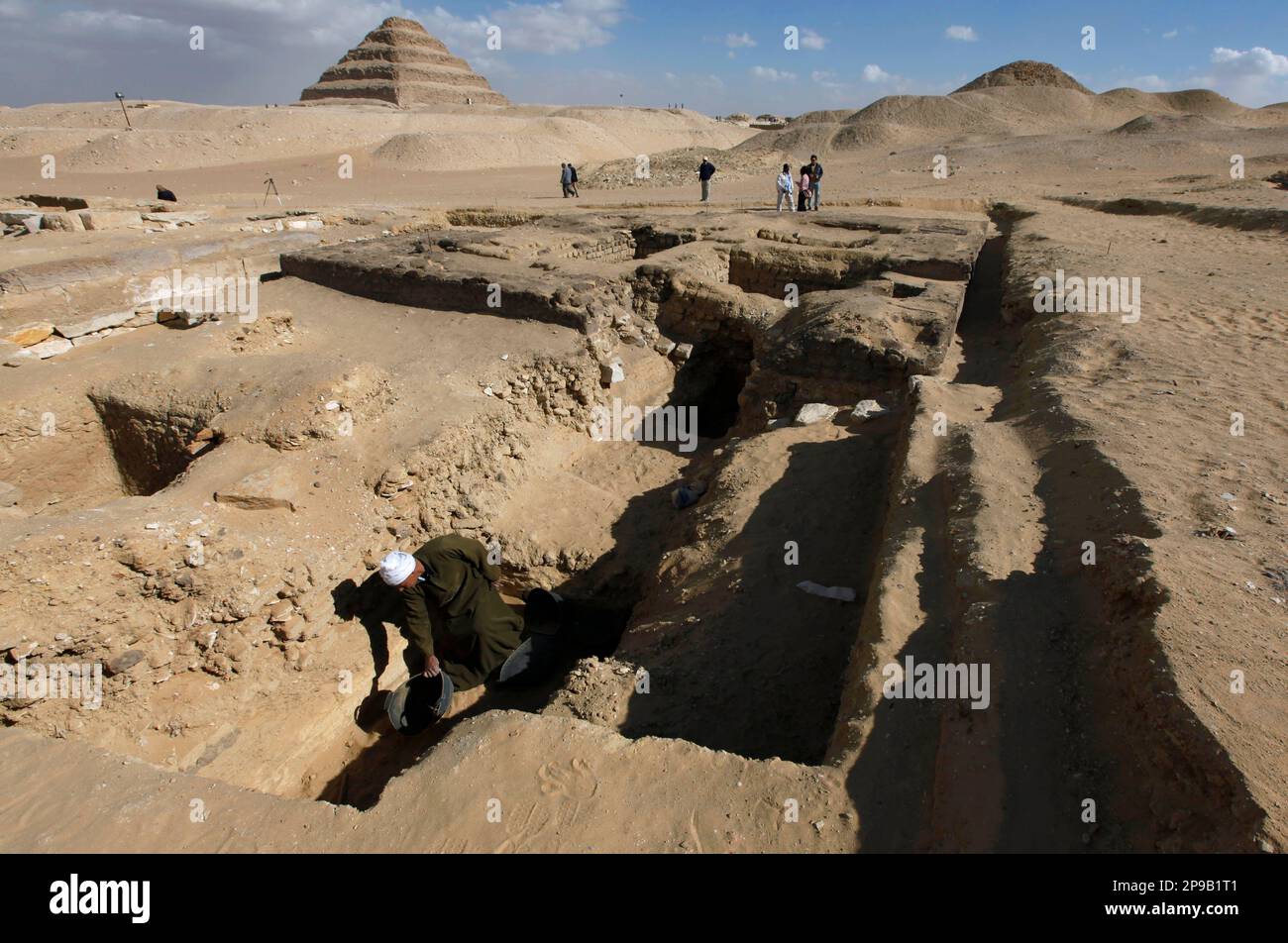An Egyptian labor works in the excavations in the Saqqara burial site ...