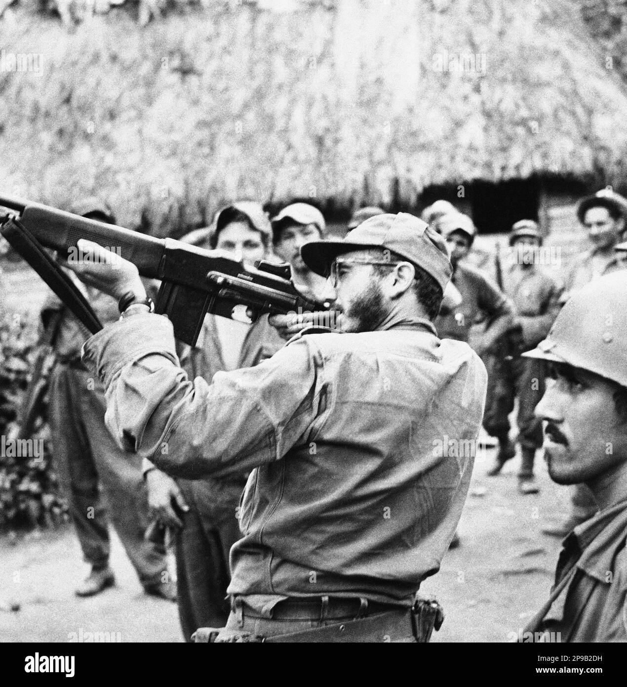 ** FILE ** Cuban rebel leader Fidel Castro is shown pointing his rifle ...