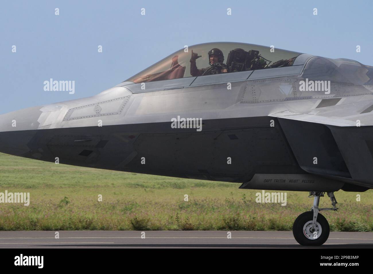 An F-22 Raptor pilot from the 154th Wing drives down the taxiway March ...