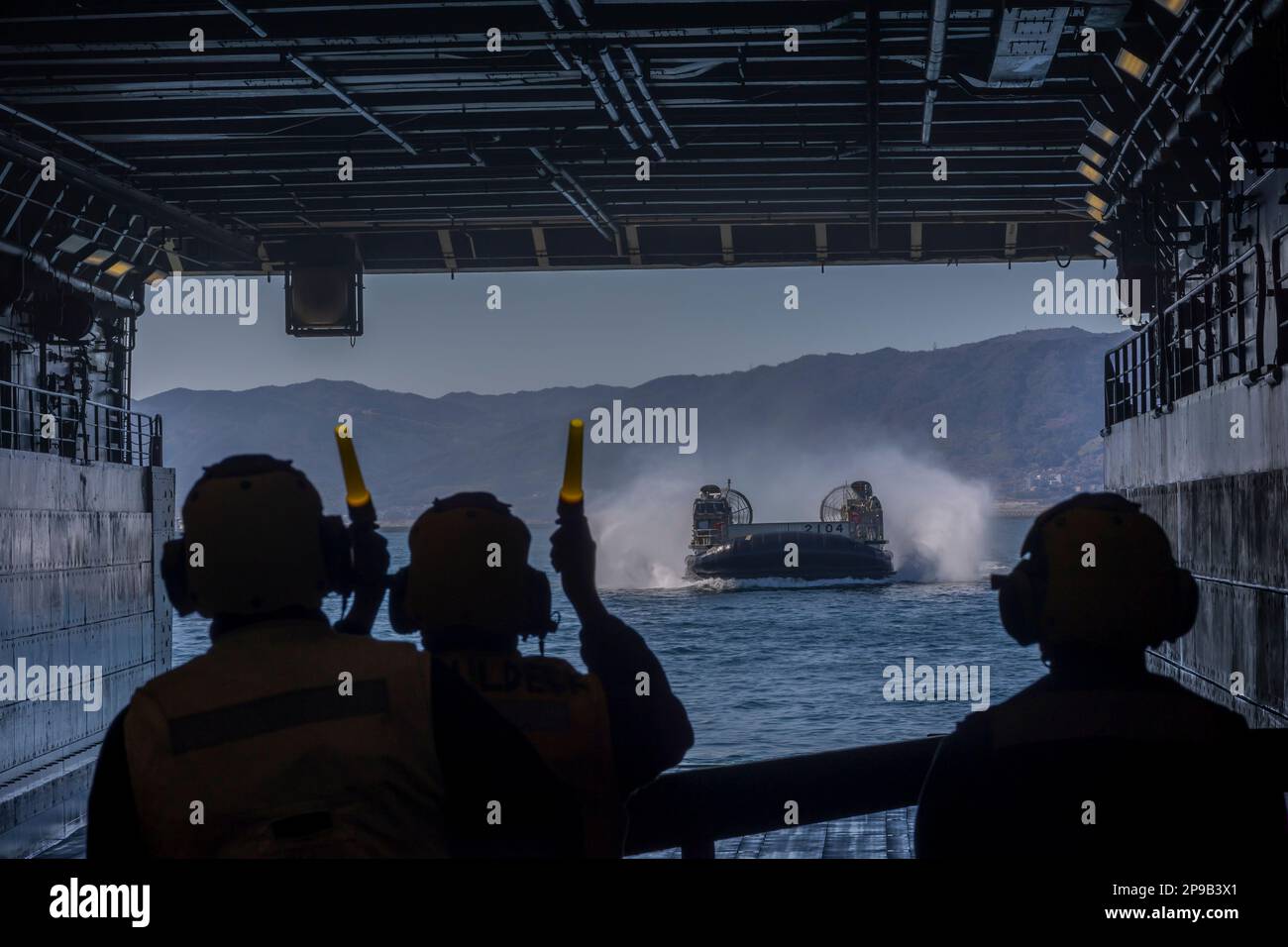 Sailors with the Japan Maritime Self-Defense Force prepare to board the ...