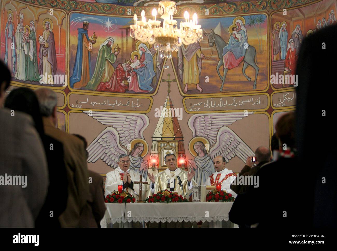 Latin Patriarch of Jerusalem Fouad Twal, center, celebrates Sunday mass ...