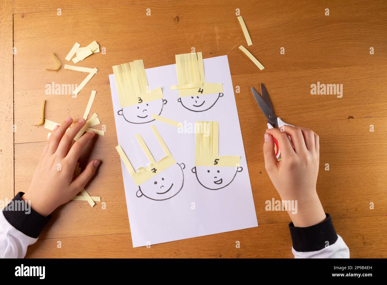 preschooler mathematics activity, kids hands cut paper with numbers ...