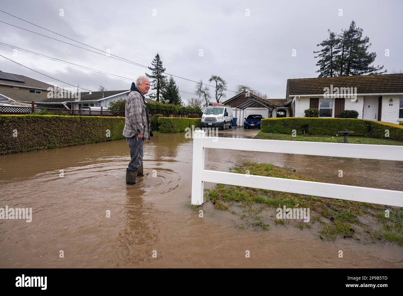 Corky Beall surveys floodwaters on College Road in Watsonville, Calif ...